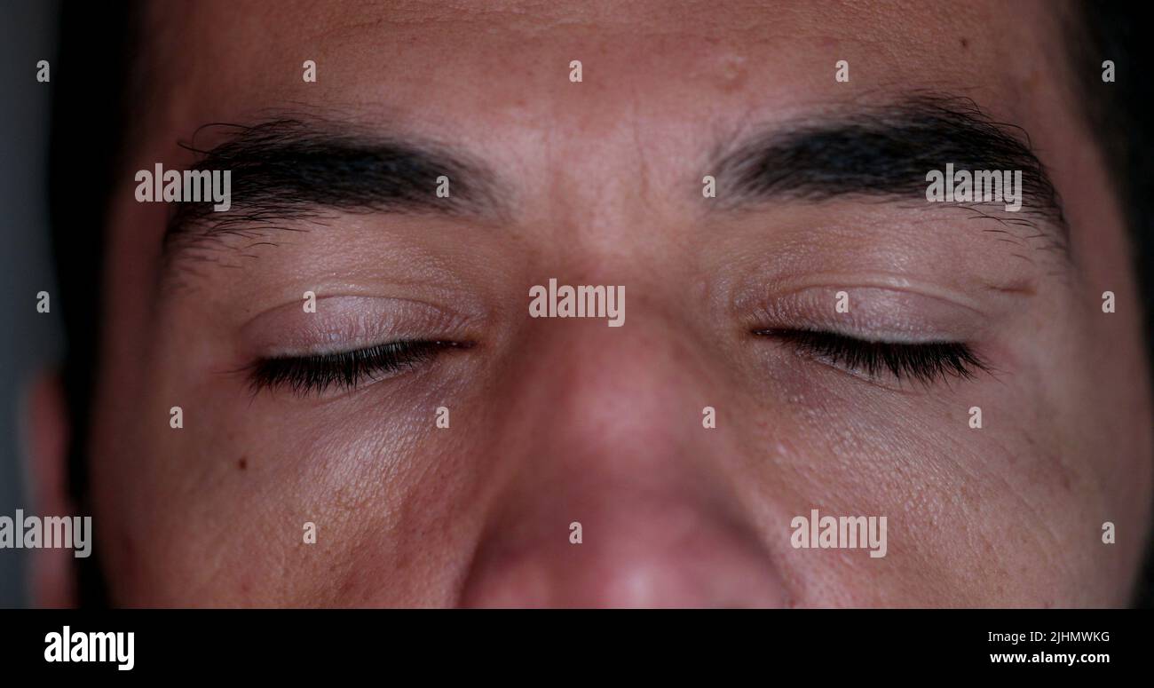 Man eyes staring camera, macro close-up man in 40s serious emotion ...