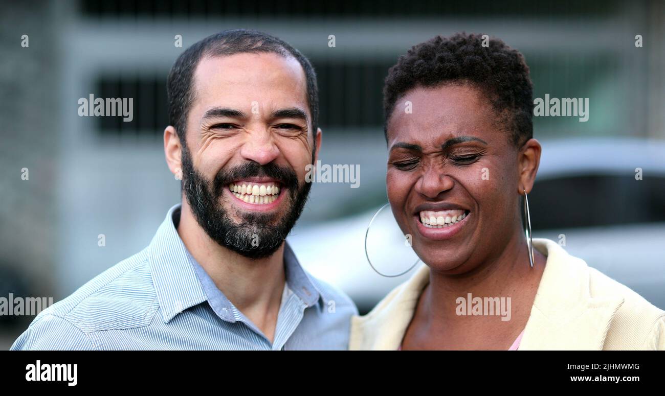 Married interracial couple laughing and smiling. African wife and ...