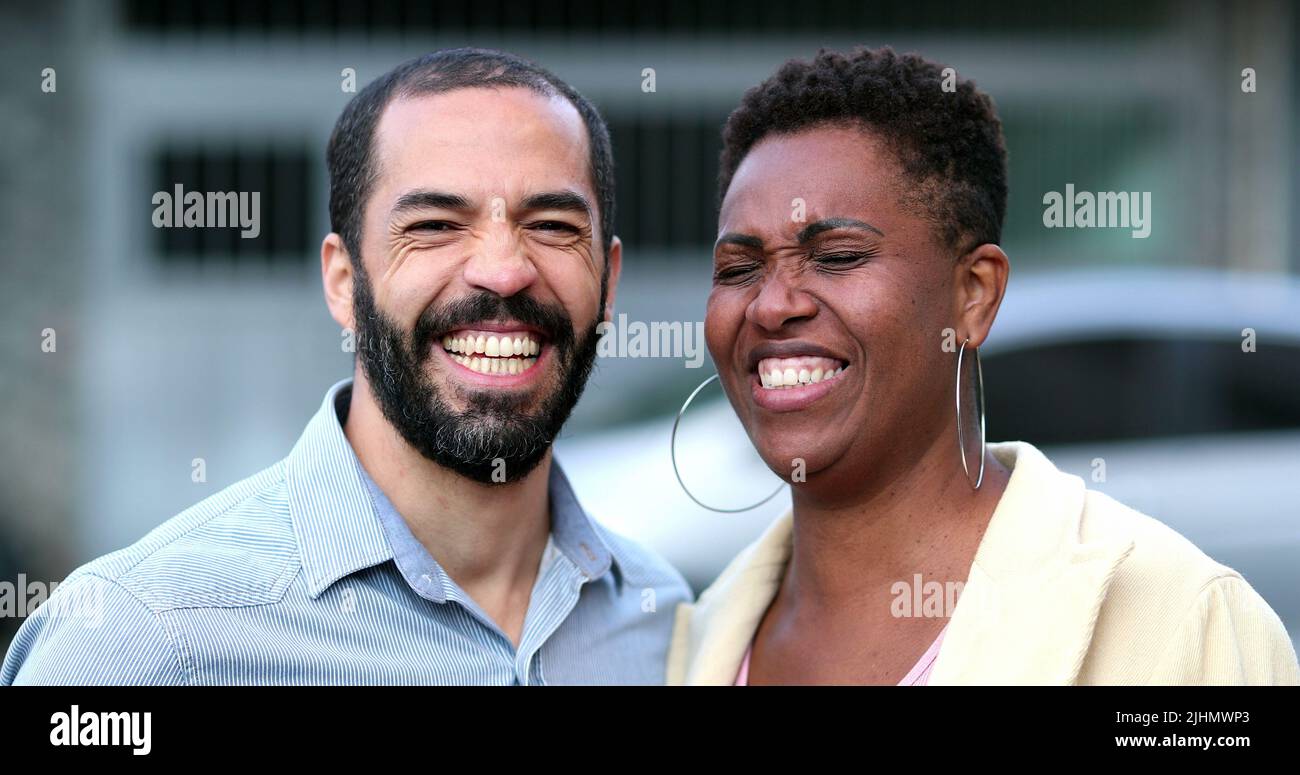 Married interracial couple laughing and smiling. African wife and ...