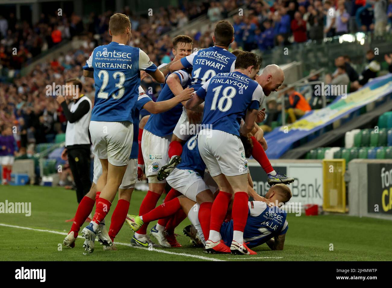 Linfield’s Kirk Millar celebrates with teammates after scoring during ...