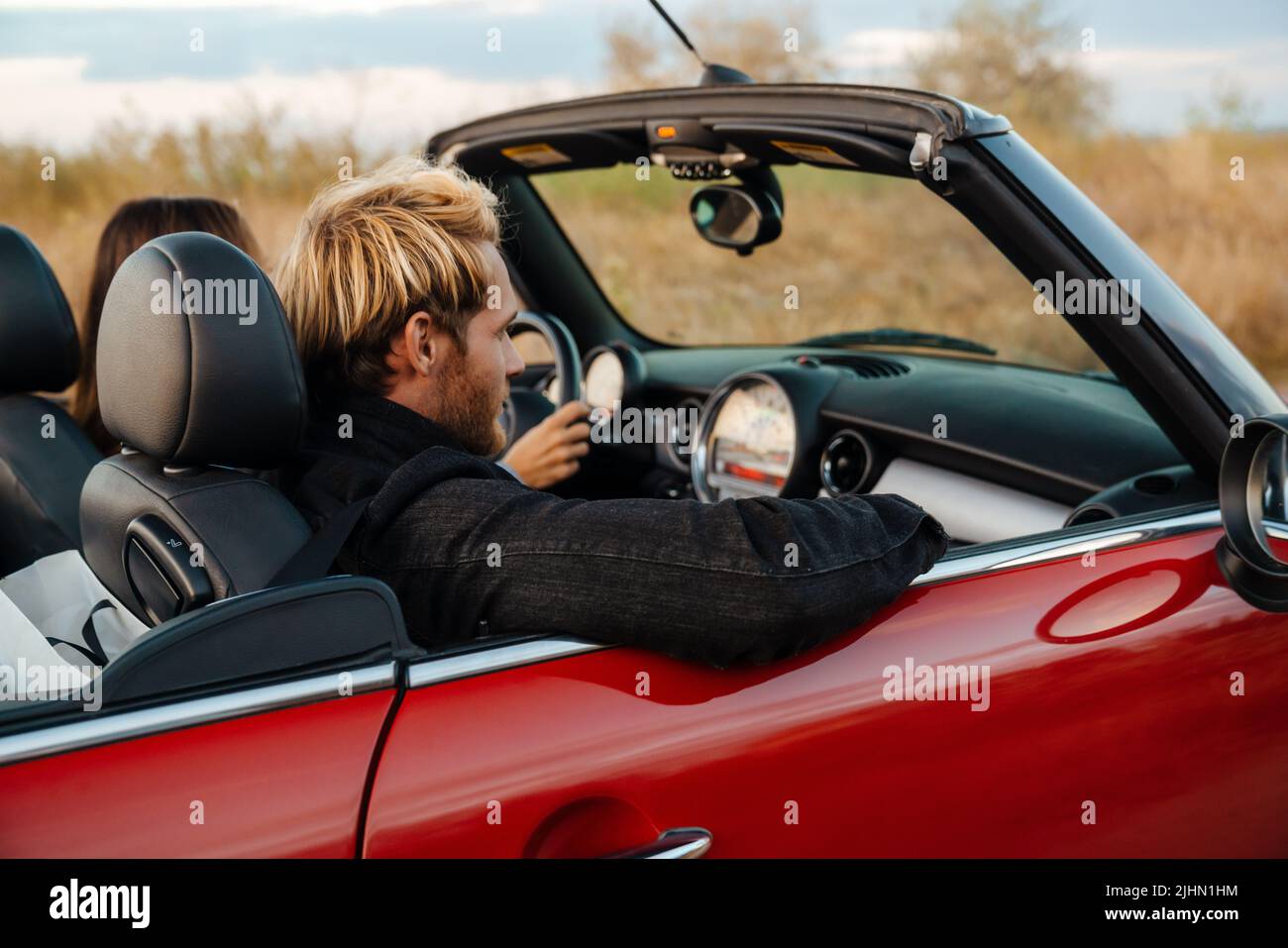 White mid couple driving together in car during trip Stock Photo - Alamy