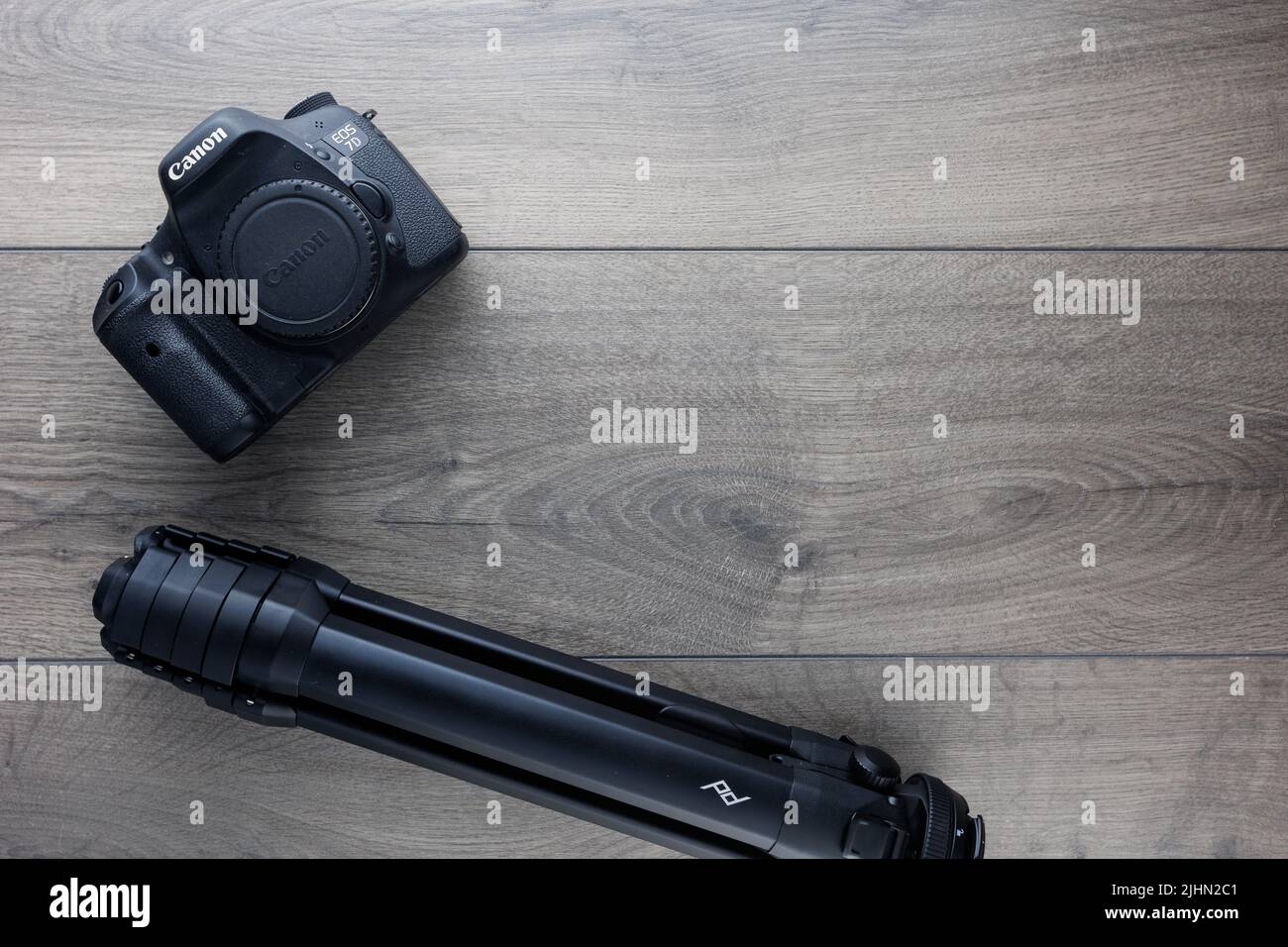 Canon 7D, Peak Design Travel Tripod flat lay on wooden background Stock ...