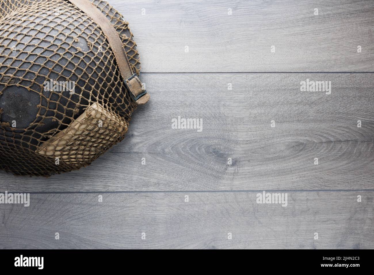 1939 dated WW2 Brodie helmet featuring netting and medical kit, worn by ...