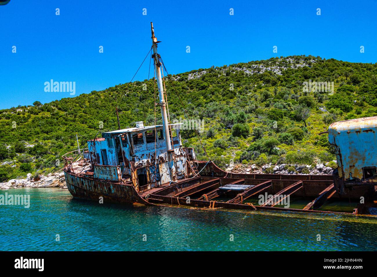 Seaside view over rusty shipwreck of an old cargo ship at Peristera ...