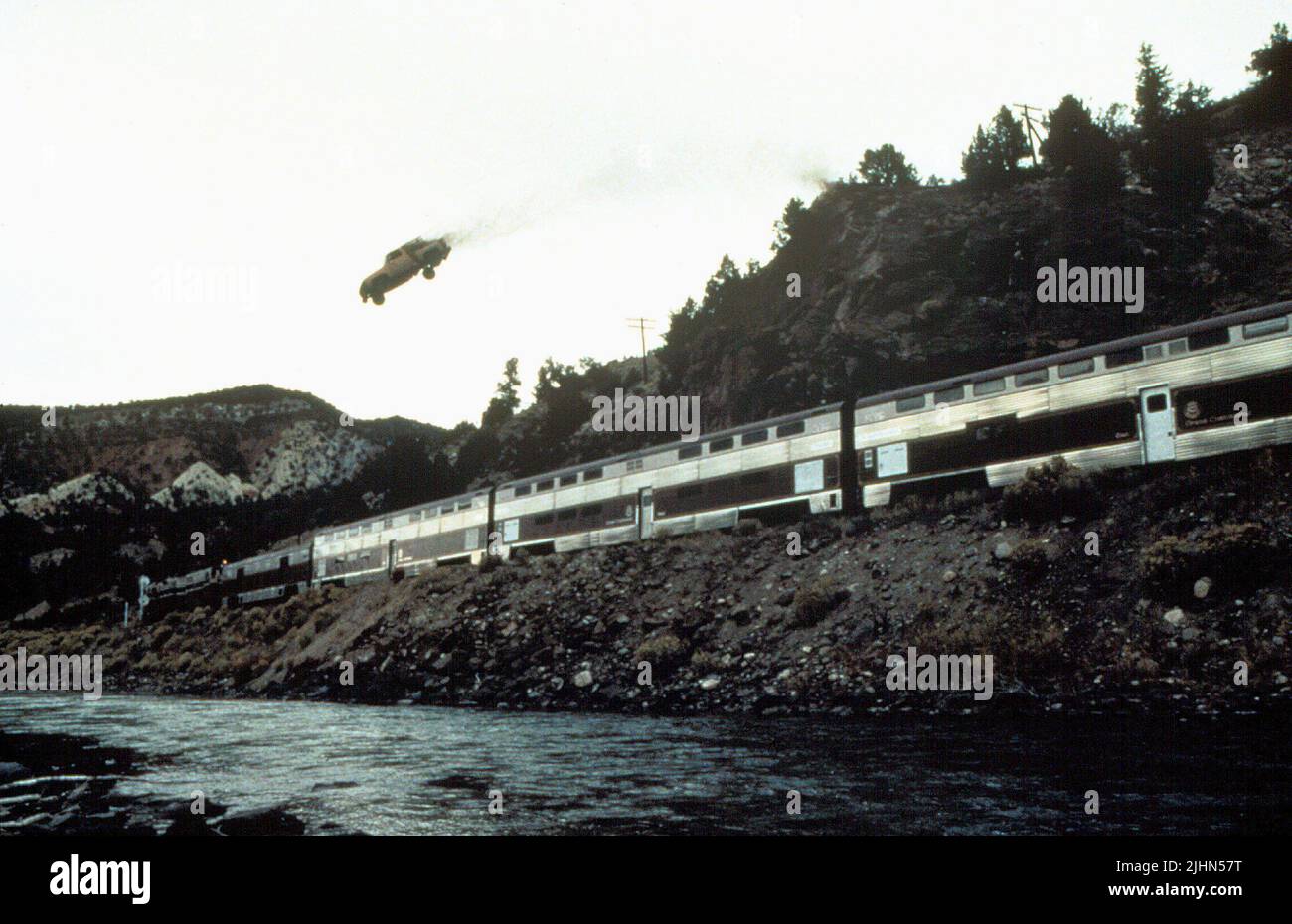 CAR LEAPS OVER TRAIN, UNDER SIEGE 2: DARK TERRITORY, 1995 Stock Photo ...