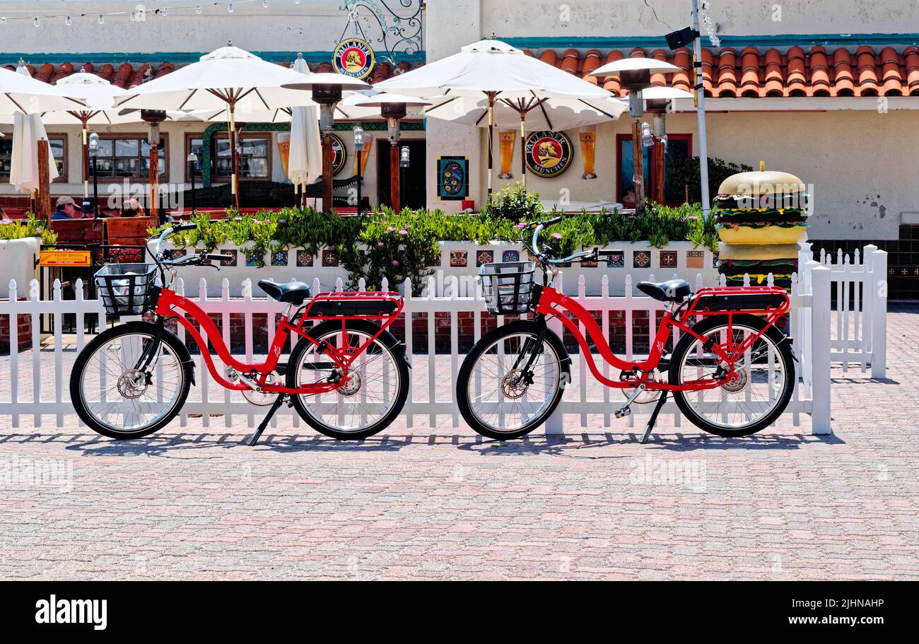 Red bicycle on fence hi-res stock photography and images - Alamy