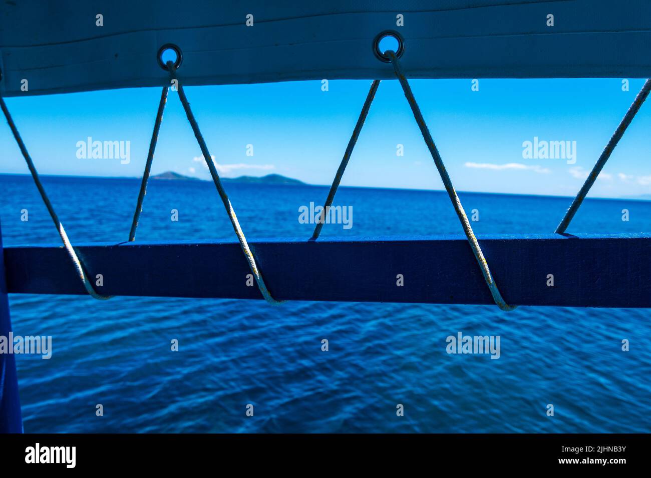 Details of a traditional wooden fishing boat in Greek colours, during ...