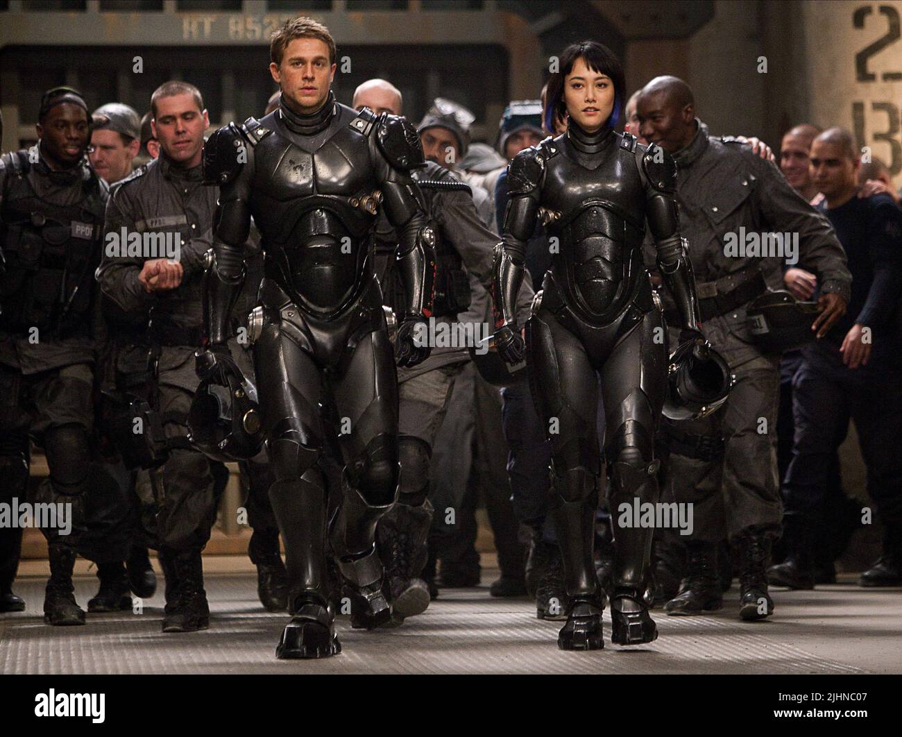 CHARLIE HUNNAM, RINKO KIKUCHI, PACIFIC RIM, 2013 Stock Photo - Alamy