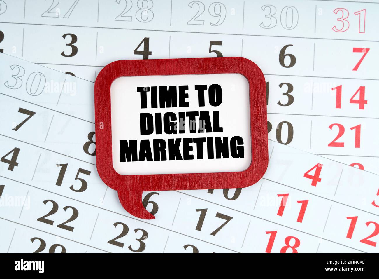 Business concept. On the calendar, a red plaque with the words inside ...