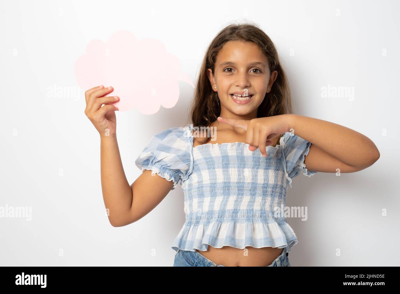 Portrait of attractive cheerful girl holding paper cloud copy space ...