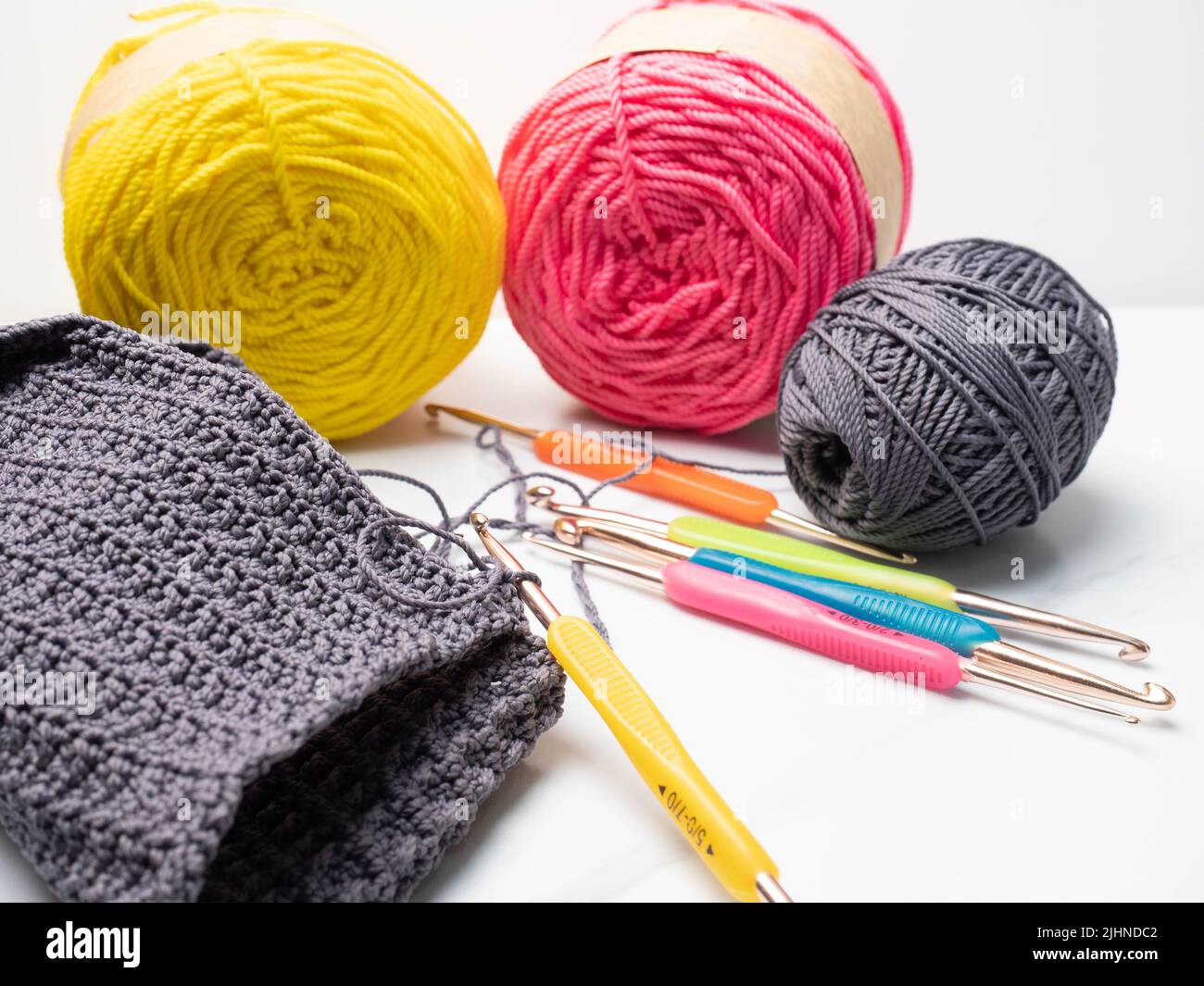 Close up shoot of knitting with crochet technique equipment Stock Photo ...