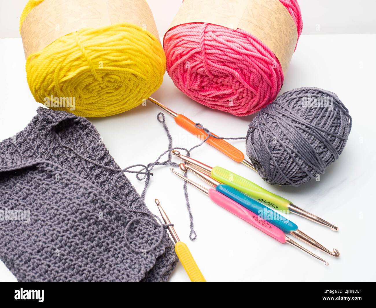 Close up shoot of knitting with crochet technique equipment Stock Photo ...