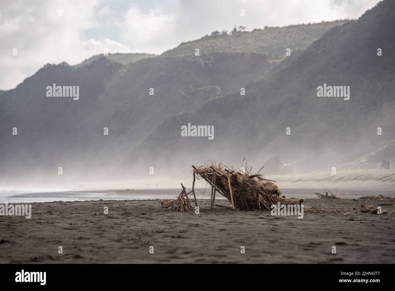 A small lean-to for shelter from the sun built by surfer's at Piha ...