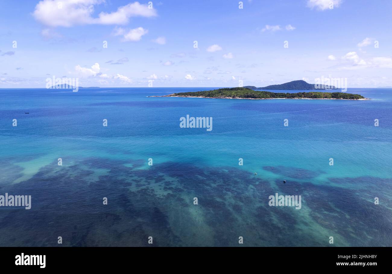 Aerial view landscape of small island in tropical sea against blue sky ...