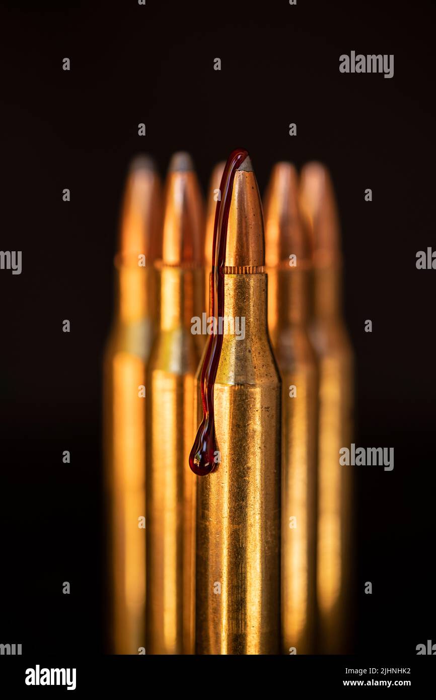 AR-15 style rifle cartridge and blood (photoillustration Stock Photo ...