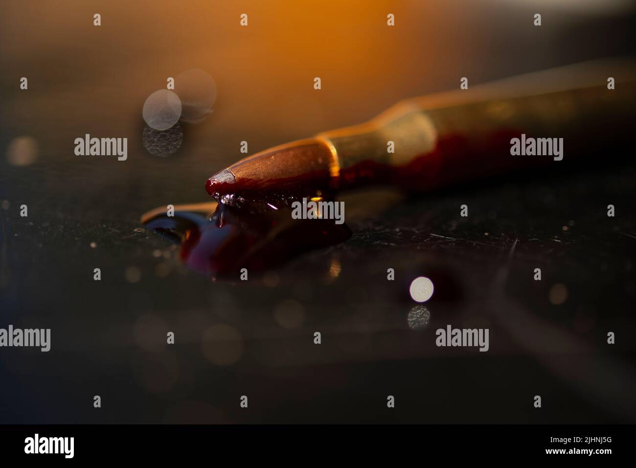 AR-15 style rifle cartridge and blood (photoillustration Stock Photo ...
