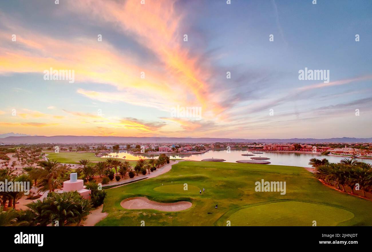 Green Field with the Colorful Sky at Sunset - Showing the amazing ...