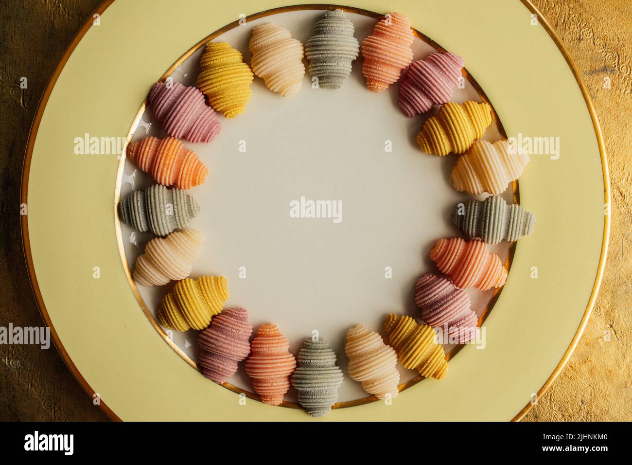 colorful Sea Conch Shells "Conchiglioni" pasta arrangement in circle on ...