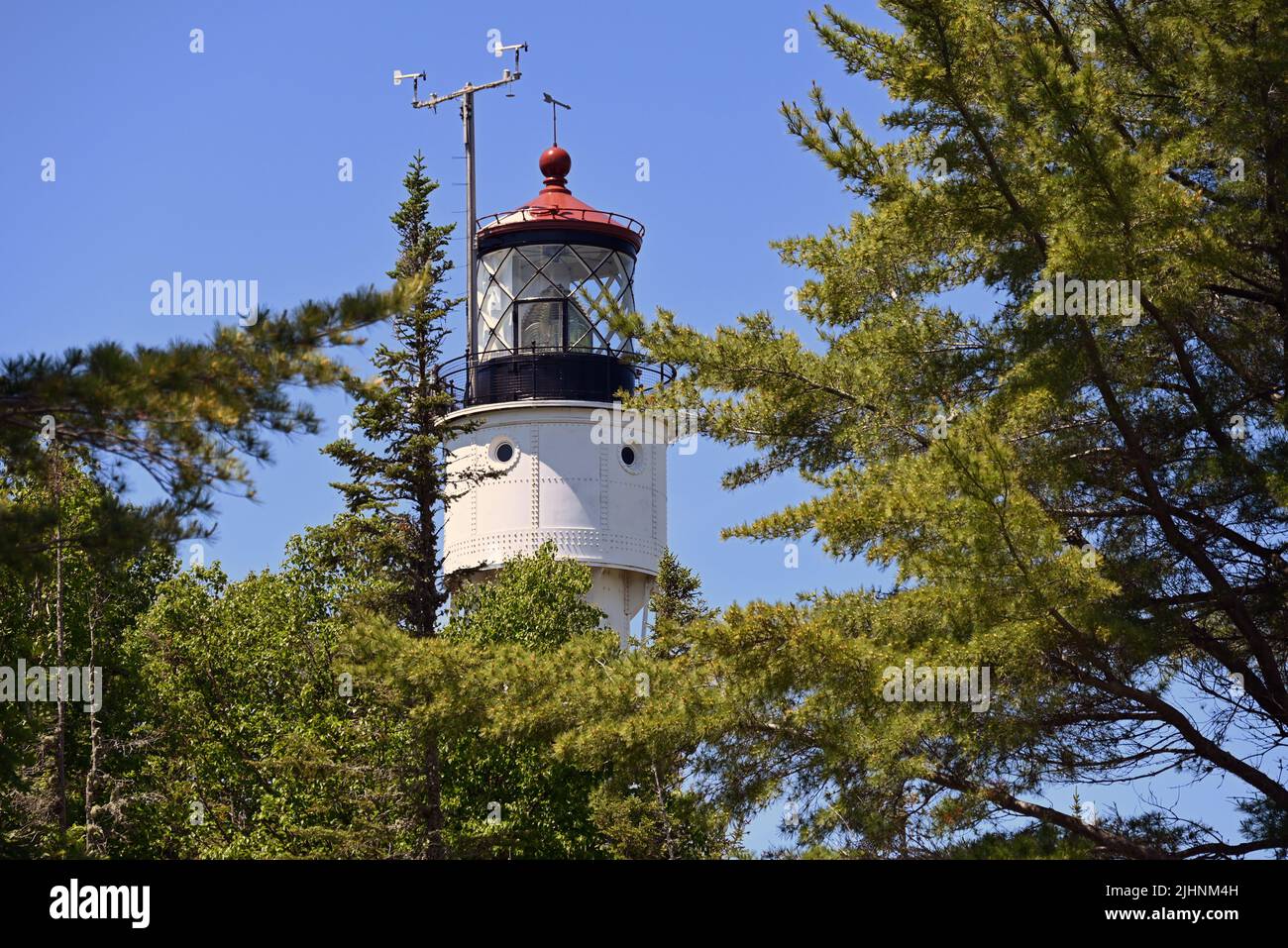 The Devils Island lighthouse rises above the trees in the Apostle ...