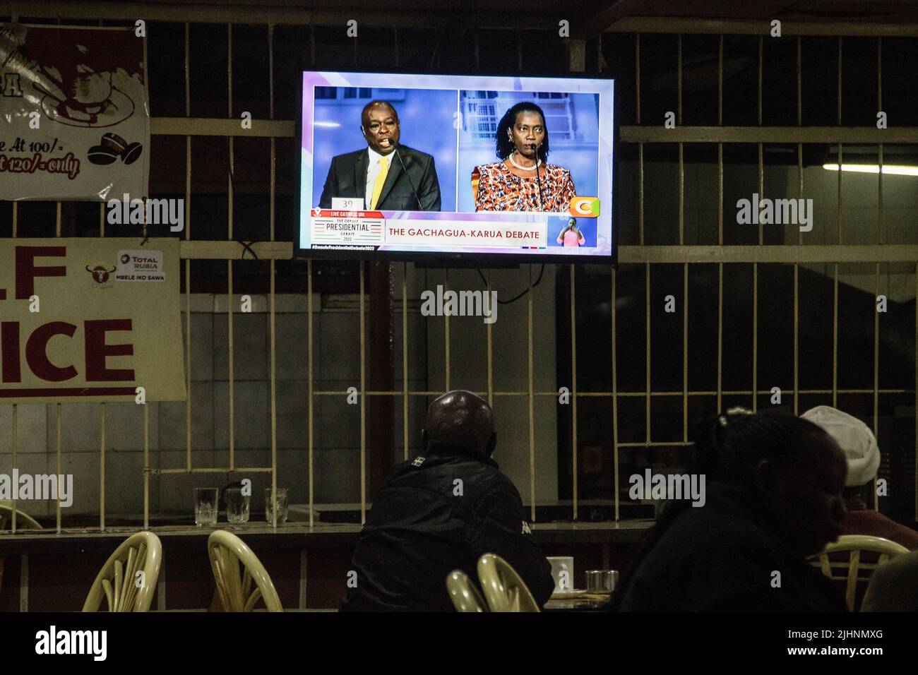 Nakuru, Kenya. 19th July, 2022. People watch the live broadcast of the ...