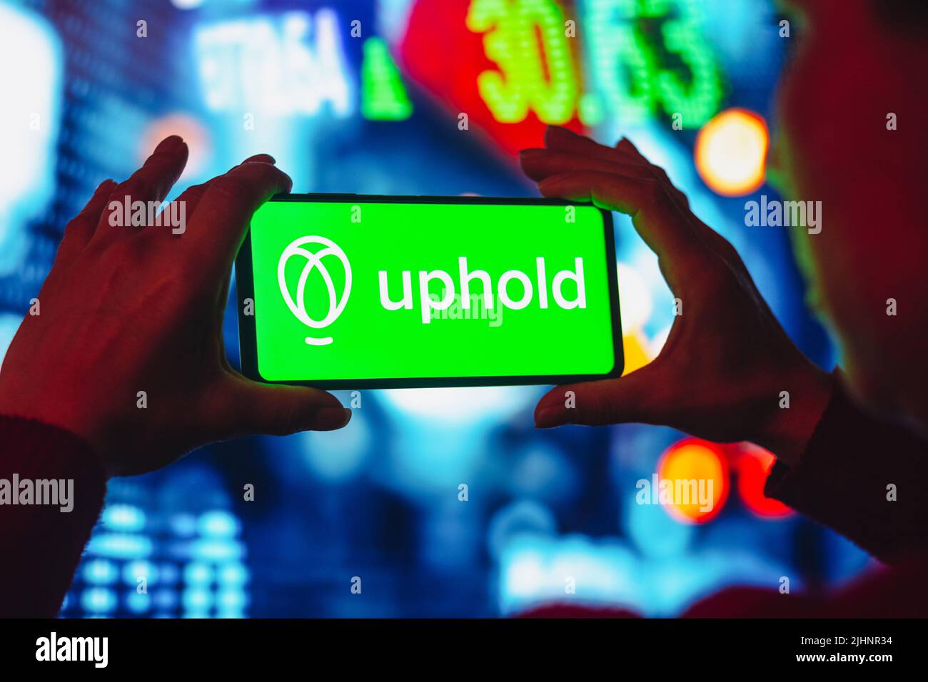 In this photo illustration, the Uphold logo seen displayed on a ...