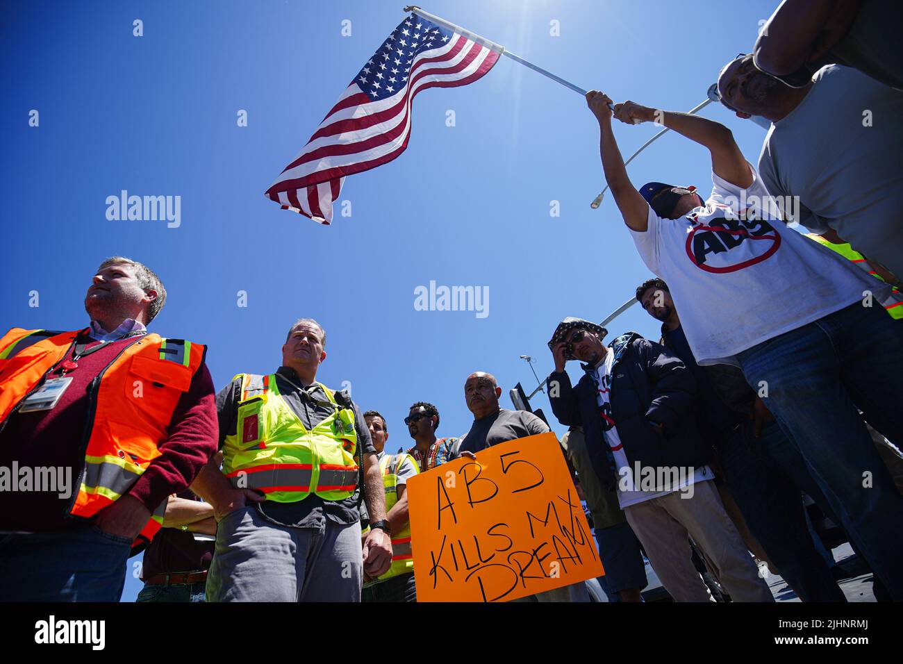 Oakland, United States. 19th July, 2022. A protester holds a placard ...