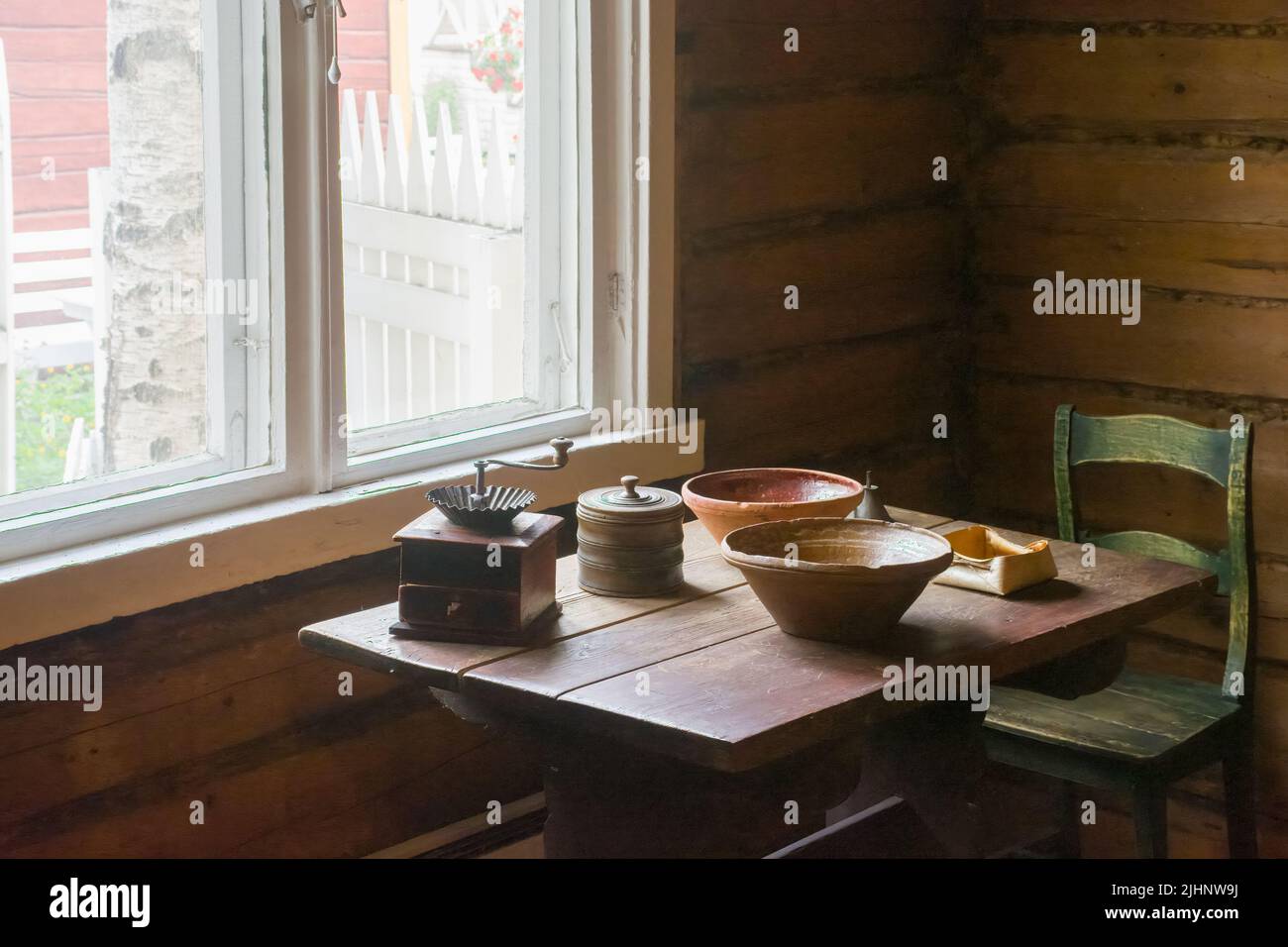 Coffee grinder and ceramic bowls on kitchen table at Amuri Museum of ...