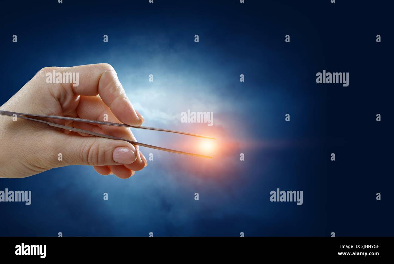 Hand glove hold surgical forceps hi-res stock photography and images ...