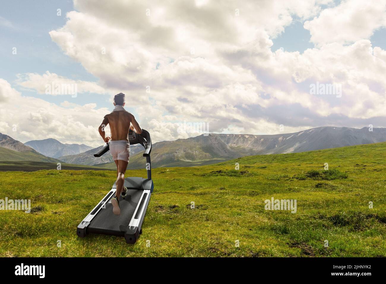 Man running on a treadmill concept Stock Photo - Alamy