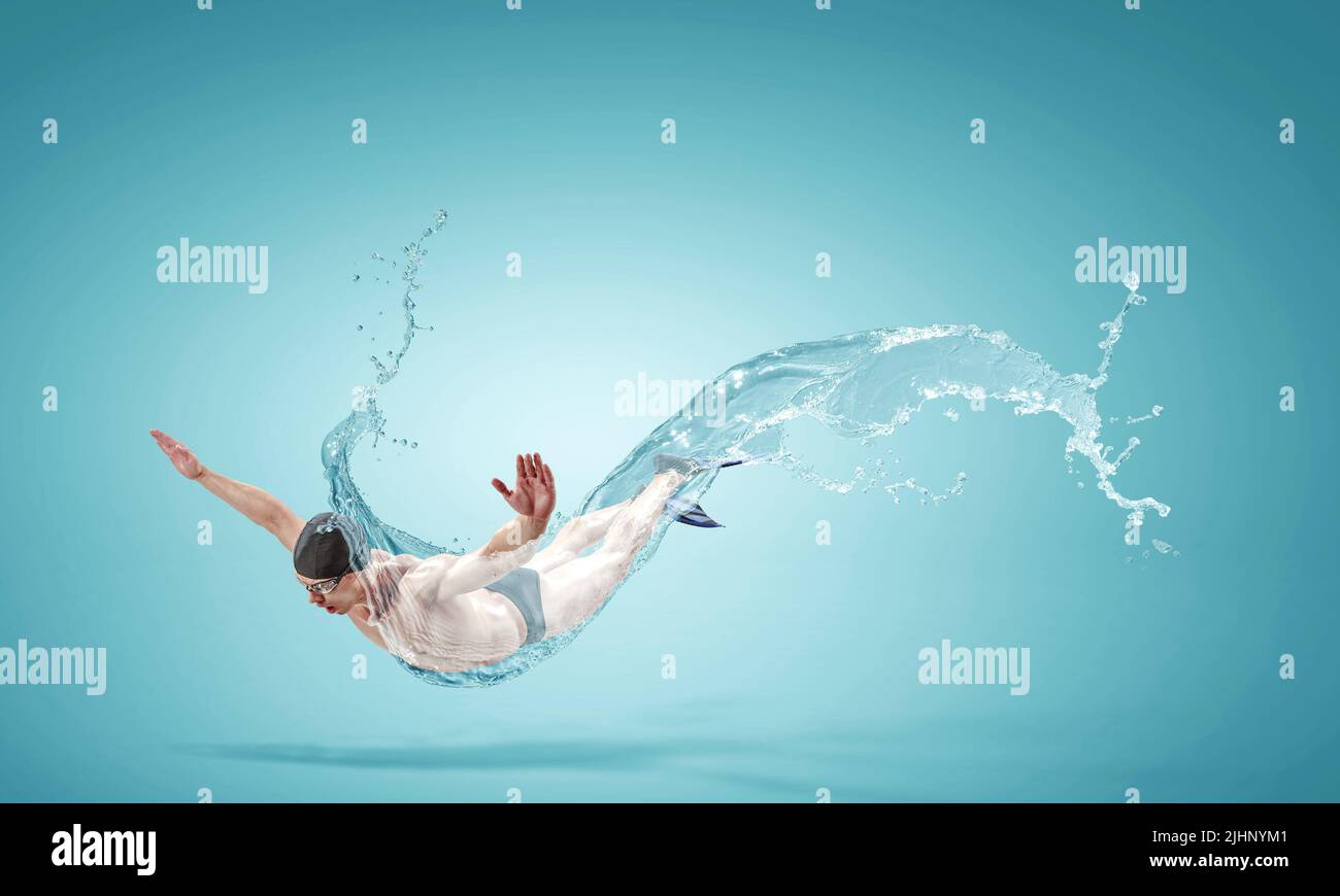 Professional man swimmer on a wave Stock Photo - Alamy