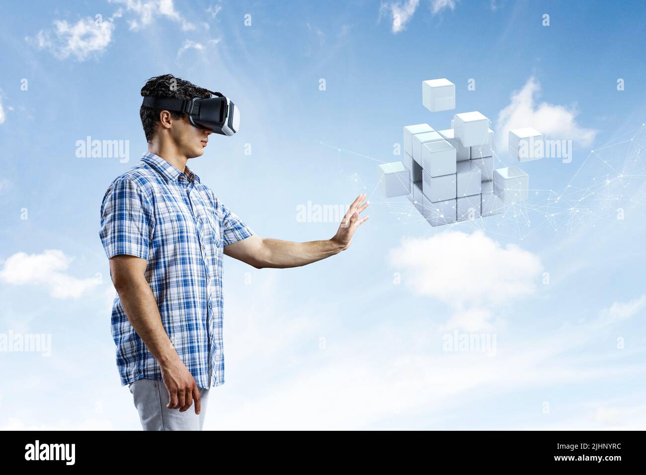 Man wearing virtual reality goggles Stock Photo - Alamy