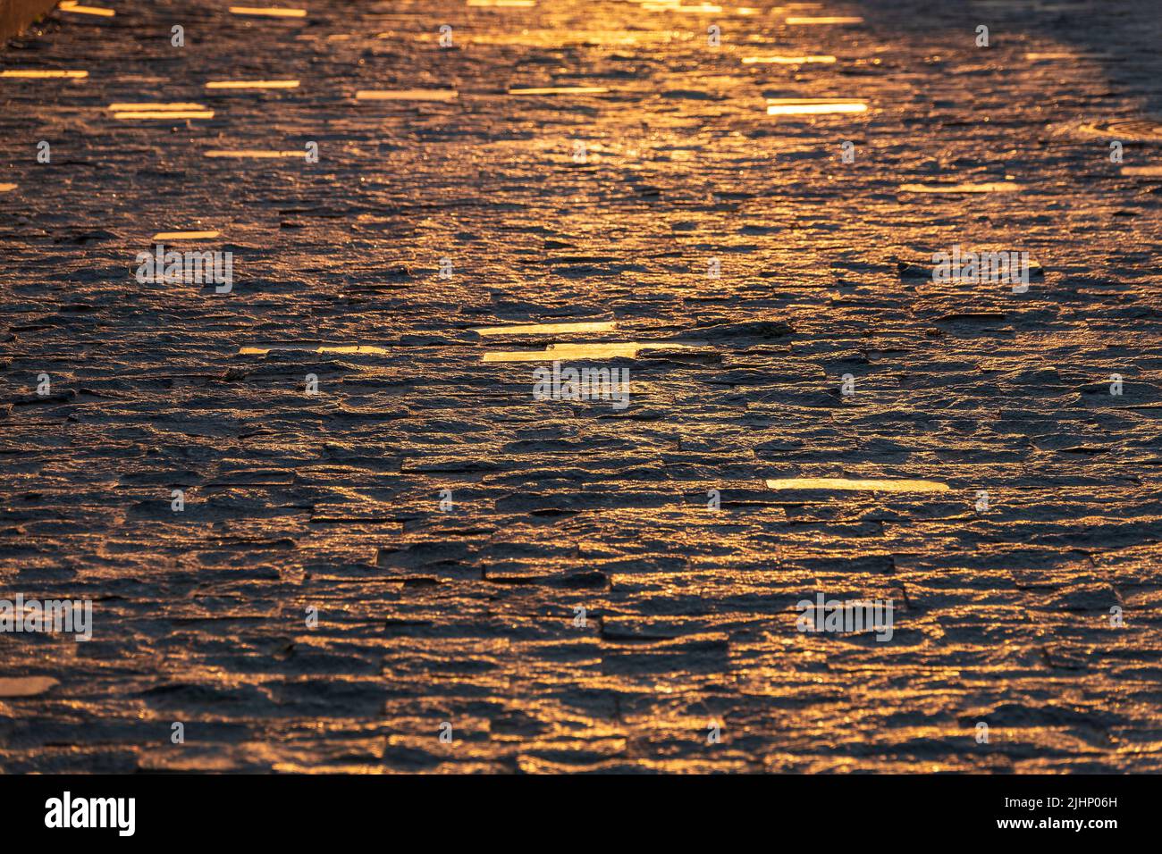 Stone pavement in the rays of the setting sun. Backround of Block ...