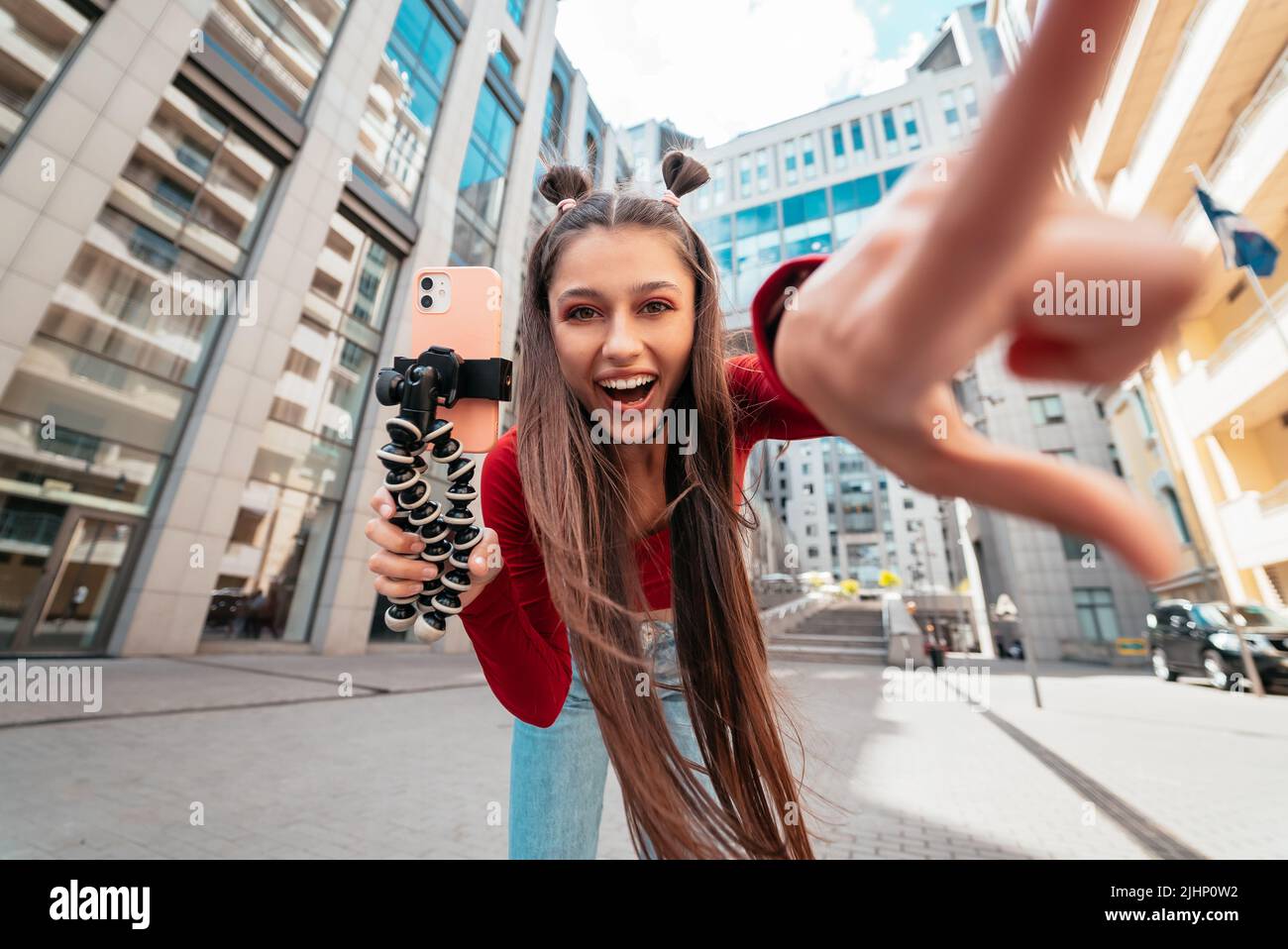 Beautiful female blogger looking at the camera on the street Stock ...