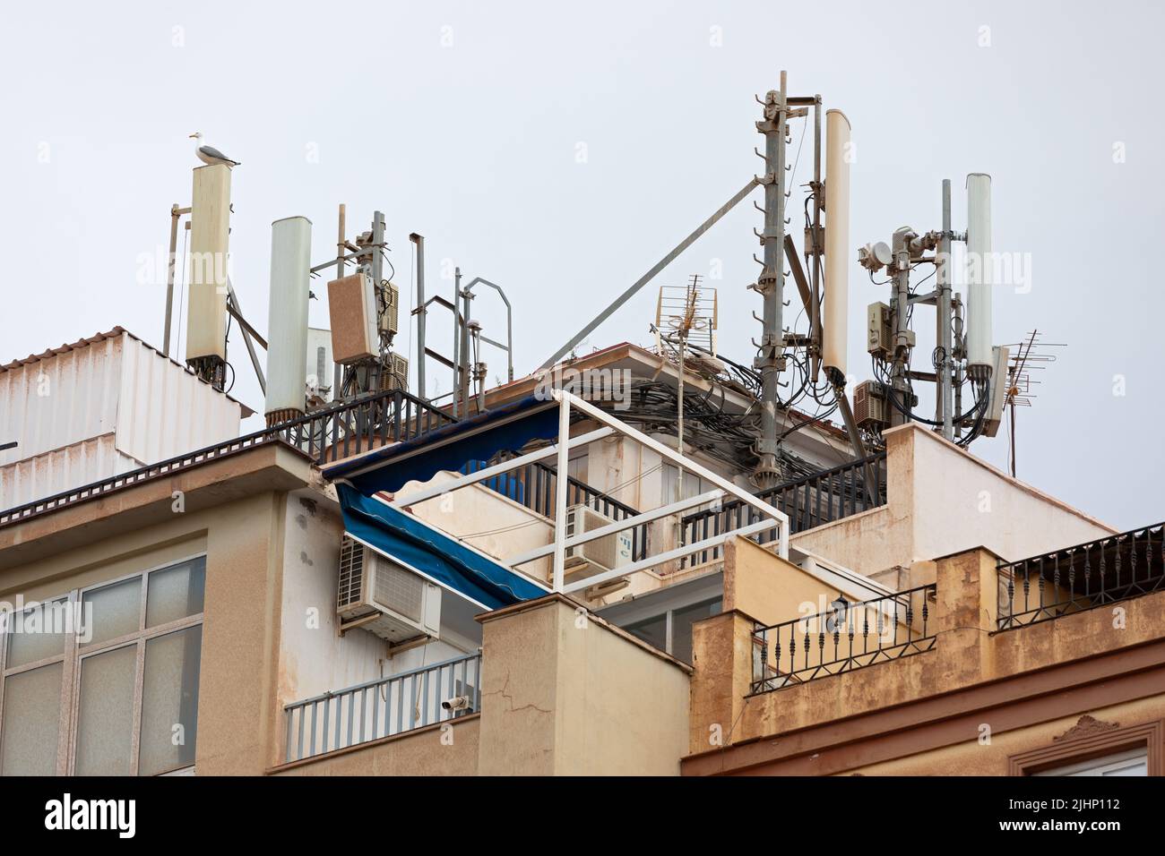 Picture of radio antennas on a roof transmitting 5g signal Stock Photo ...