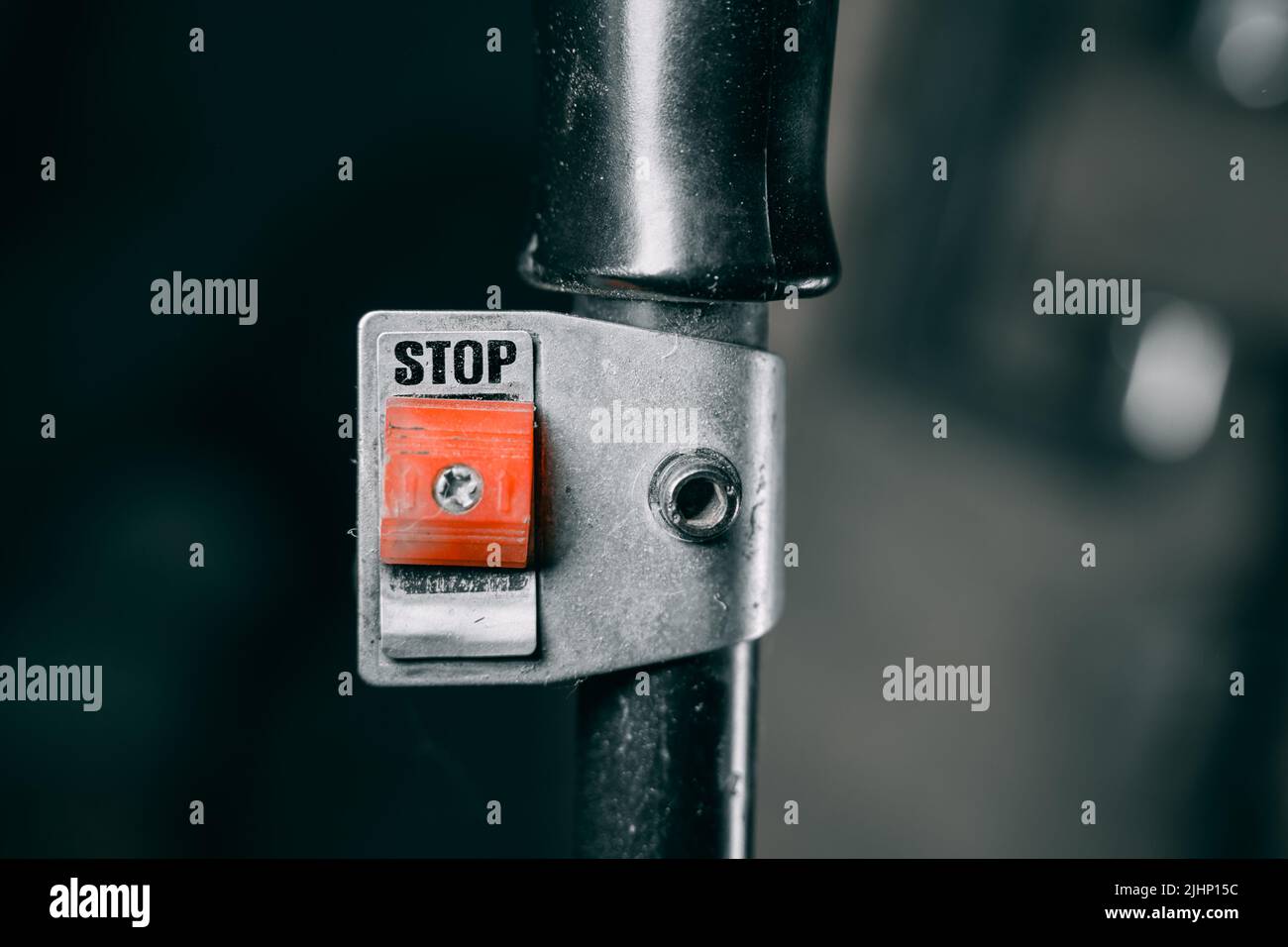 Red button toggle switch with stop inscription closeup Stock Photo - Alamy