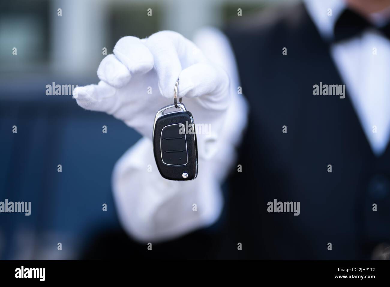 Valet Boy Hand Holding Car Key Outside The Car Stock Photo - Alamy