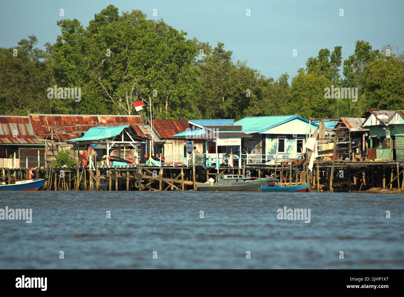 Village of Muara Sangatta on the estuary of Sangatta river in East ...