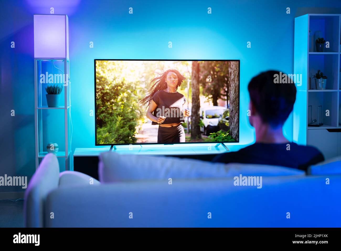 Streaming And Watching Movie On TV Screen Stock Photo - Alamy