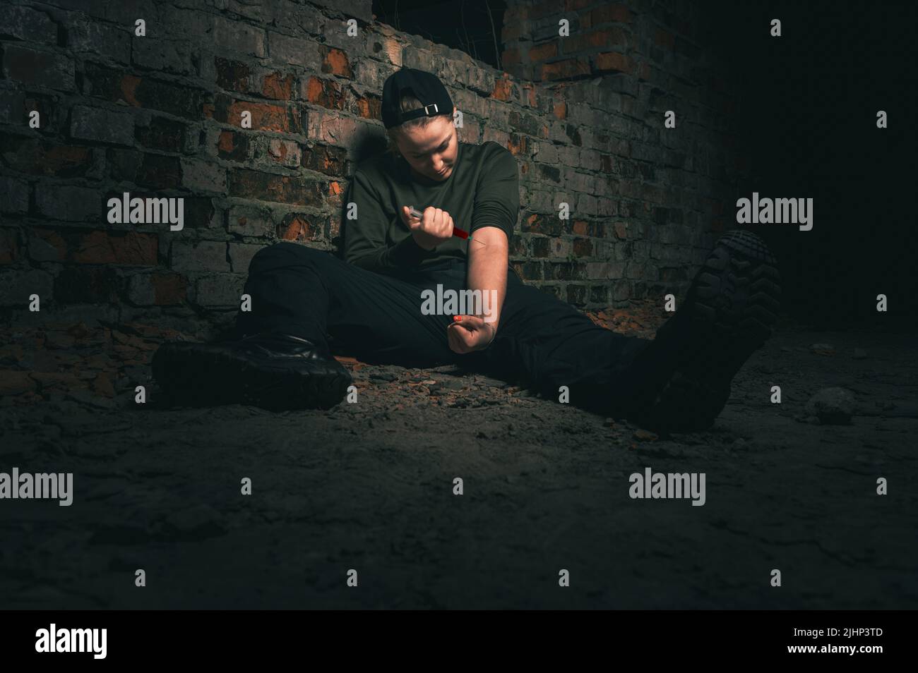 Dope obsessed woman sitting with syringe. Woman drug addict with a ...