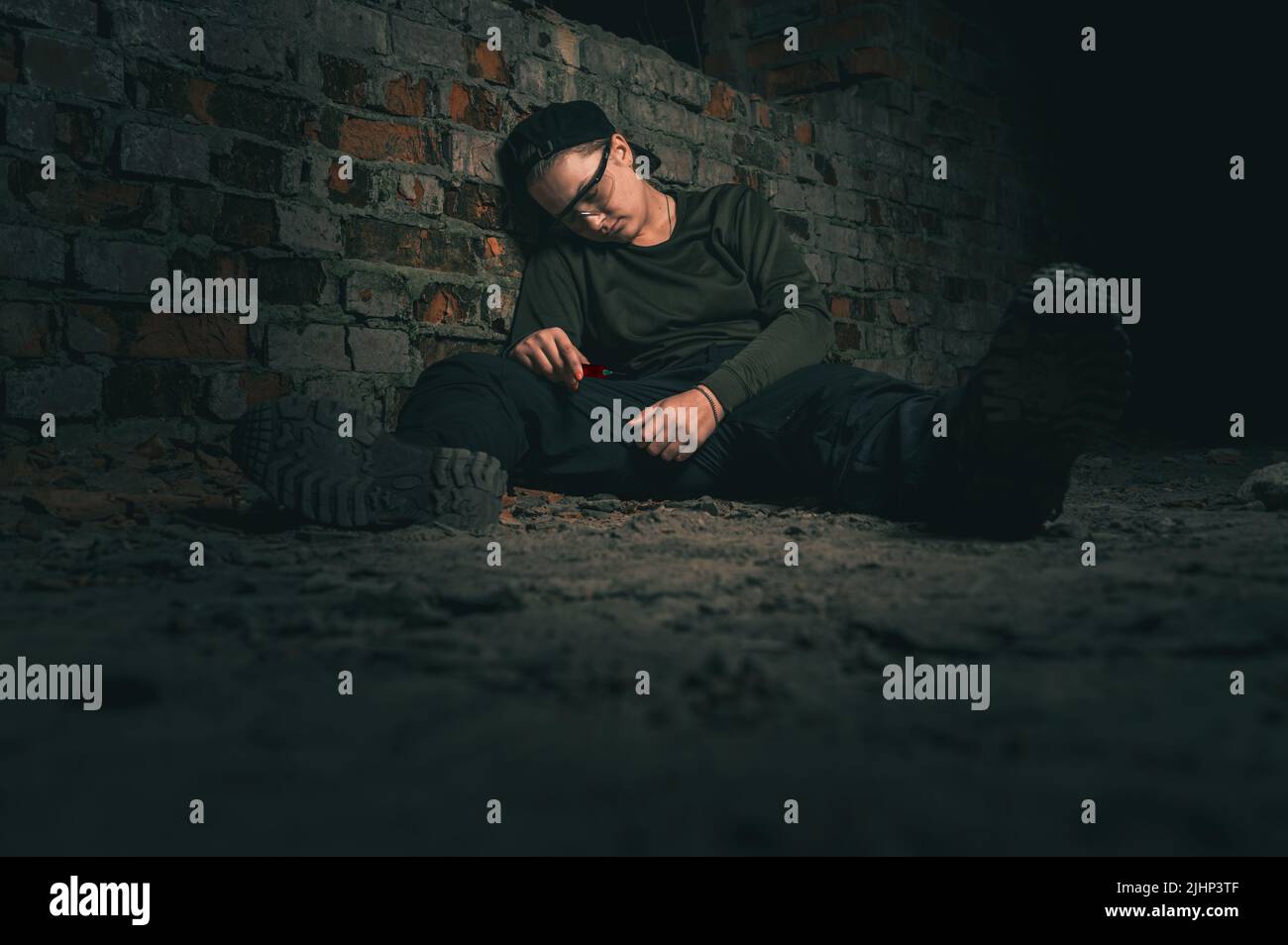 Dope obsessed woman sitting with syringe. Woman drug addict with a ...