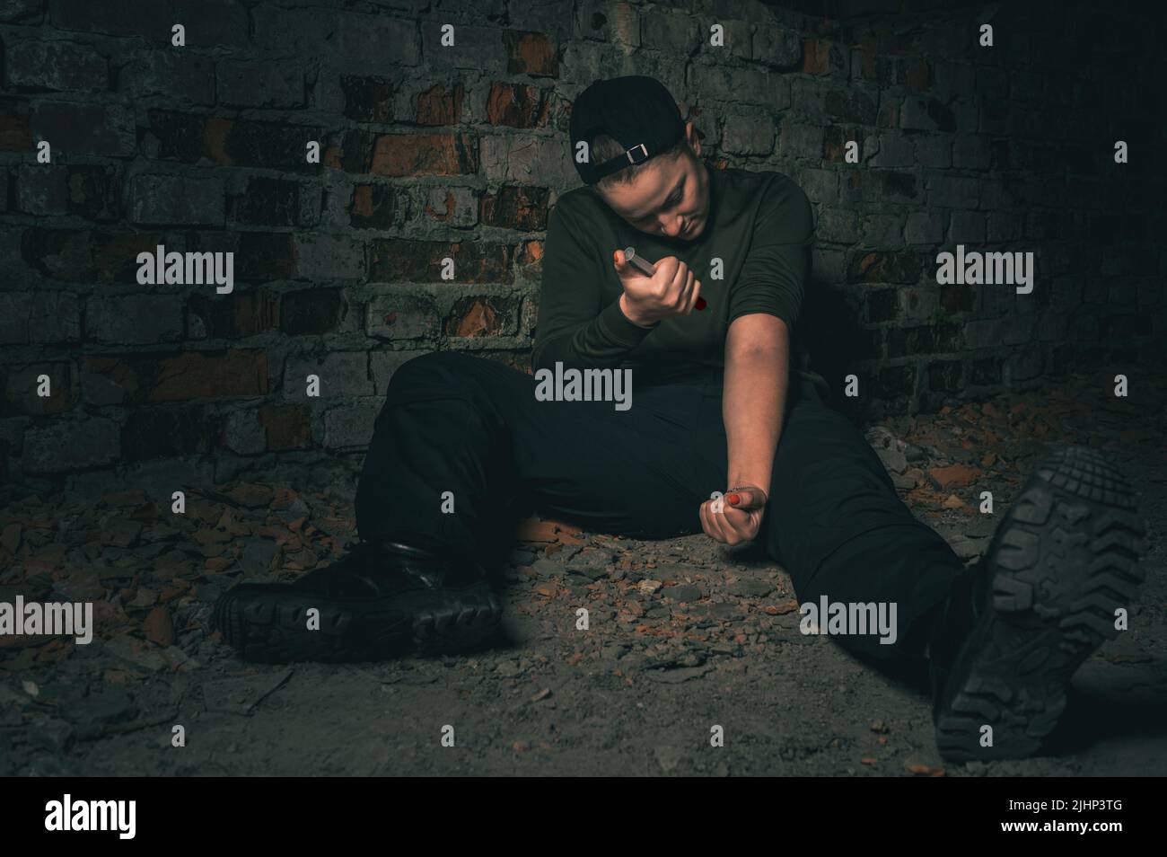 Dope obsessed woman sitting with syringe. Woman drug addict with a ...