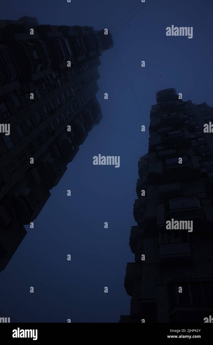 Two tall residential buildings in the form of a tower, immersed in a ...