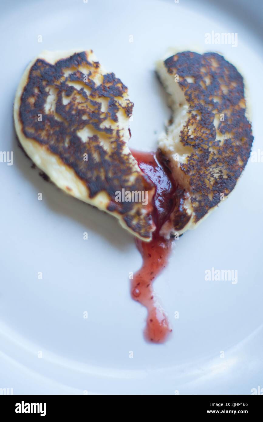 Cheesecake in the form of a broken heart Stock Photo - Alamy