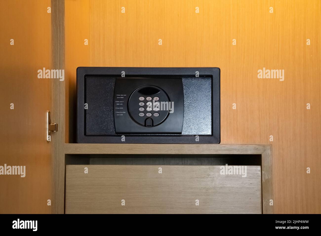 a gray safe in the wardrobe. It's a small safe that can hold valuables ...