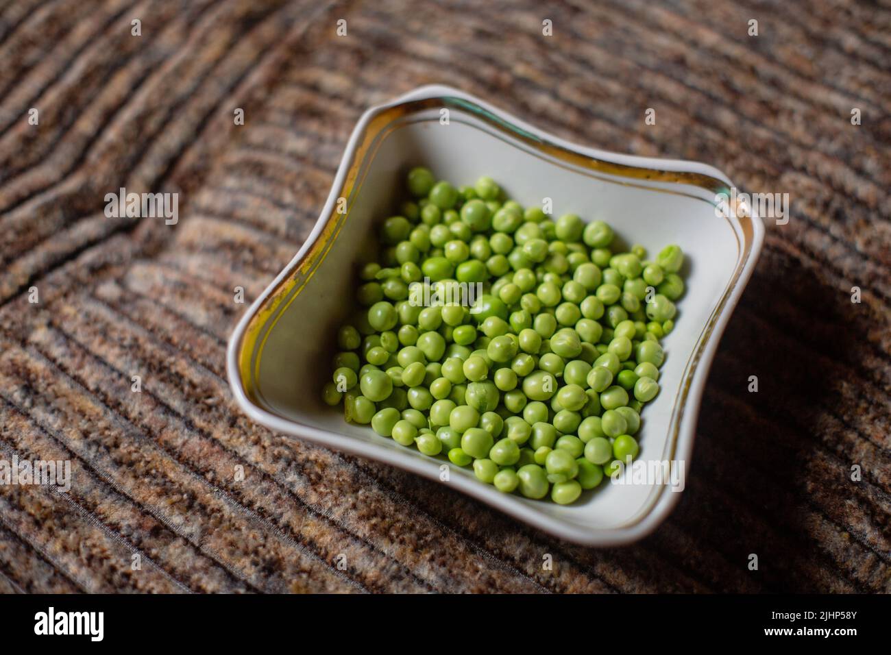 Fresh peeled green peas are in a plate Stock Photo - Alamy