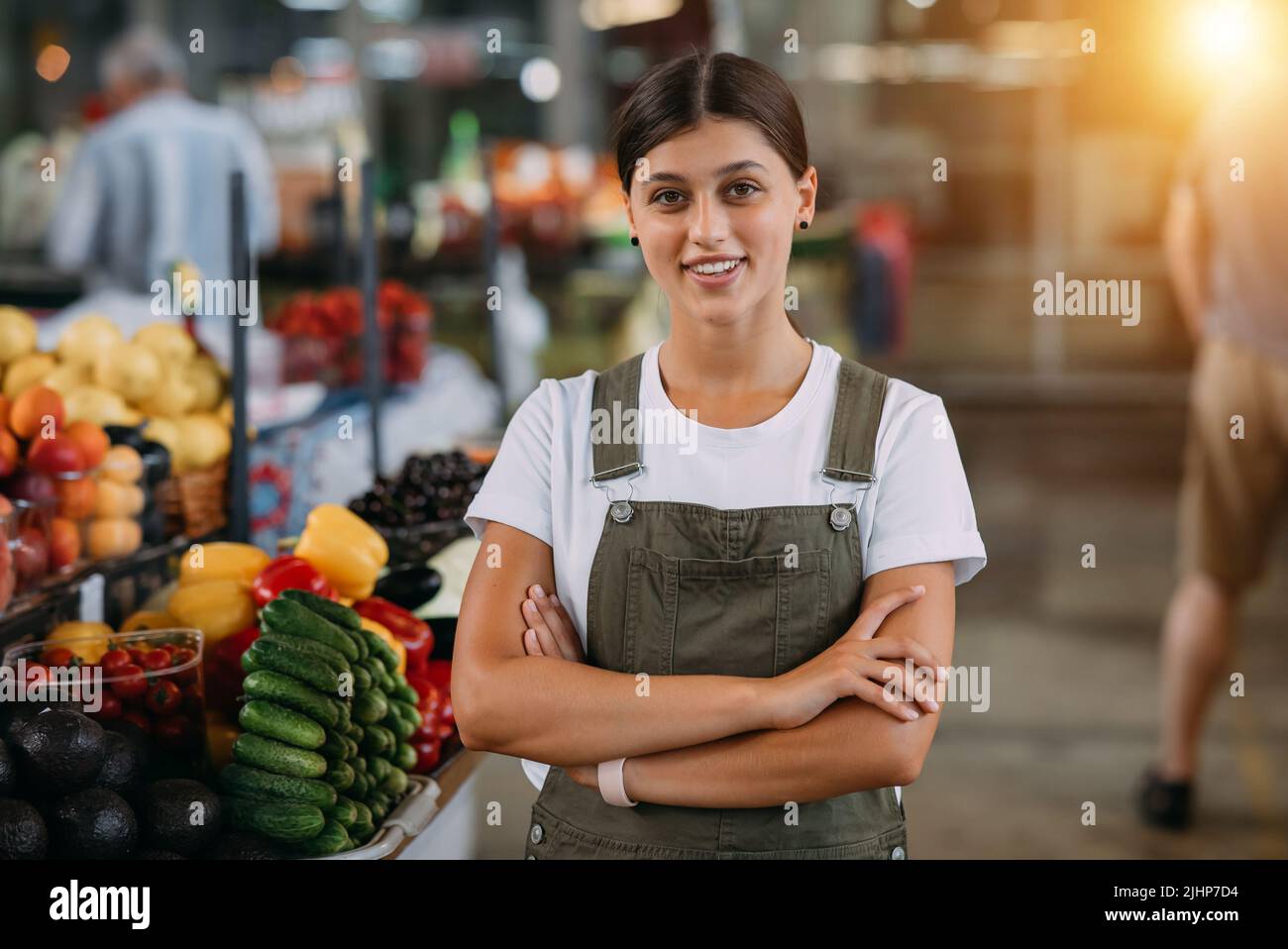 Woman seller of fruit at the market near the counter Stock Photo - Alamy