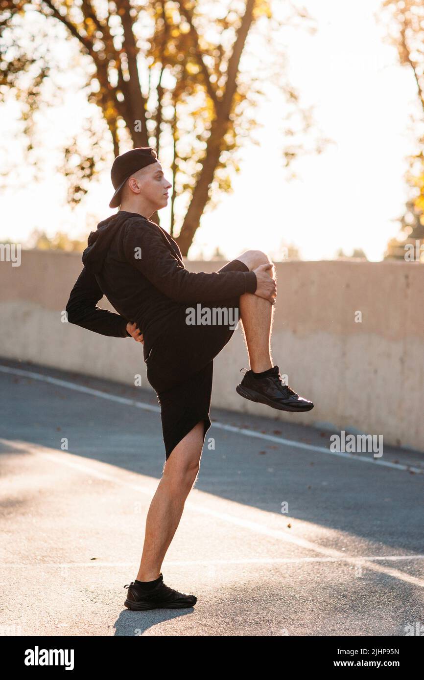 Stretching exercises before running training Stock Photo - Alamy