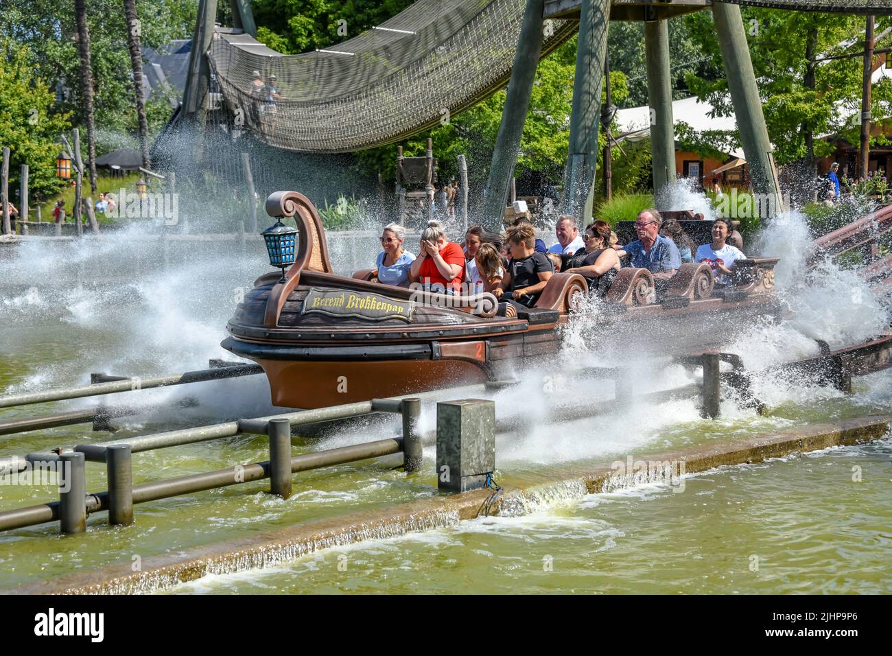 People ride SuperSplash, a water ride at Plopsaland in De Panne, in ...