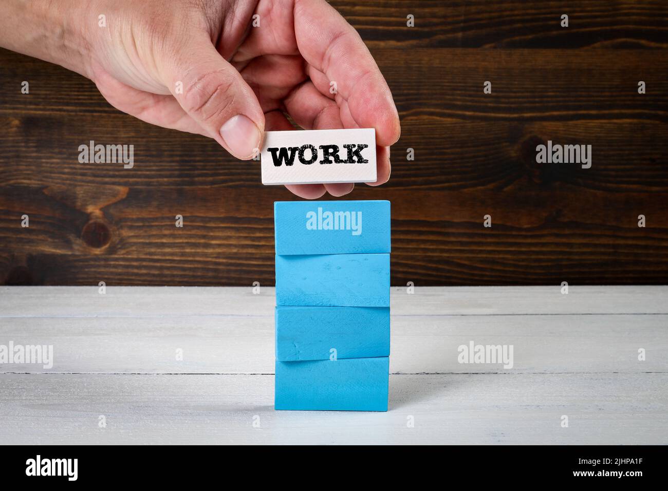 Work Concept. Colorful wooden blocks in a pile Stock Photo - Alamy