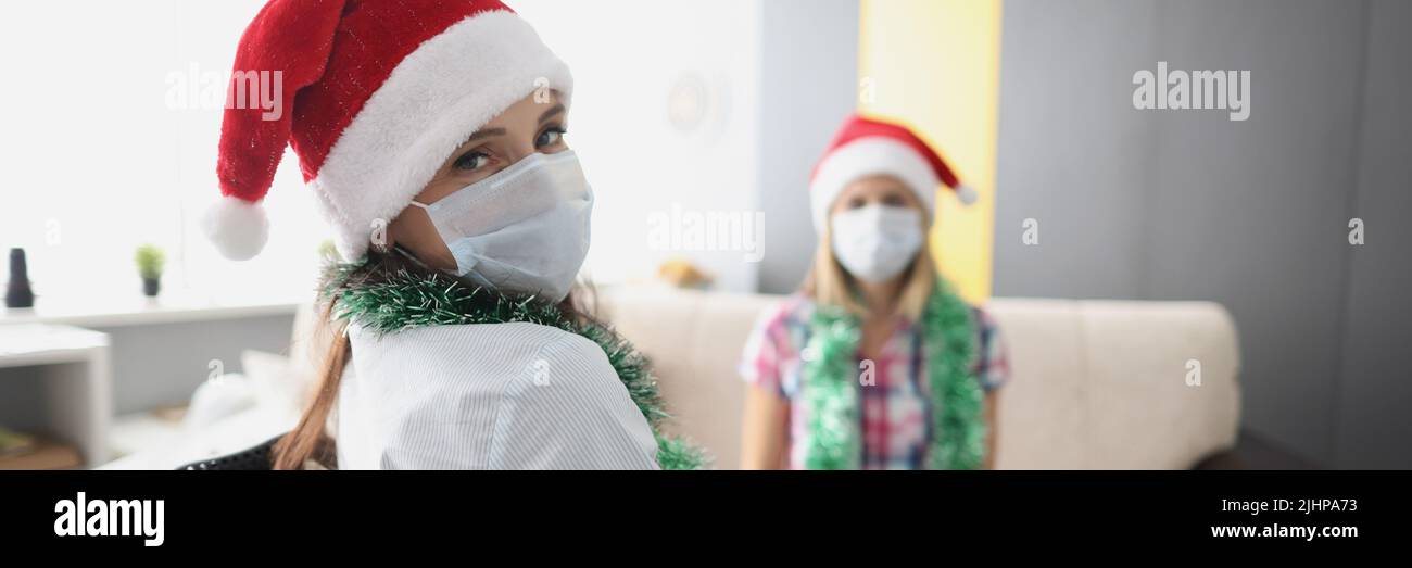 Young woman visit friend in hospital, relative in wheelchair, face mask for protection Stock ...